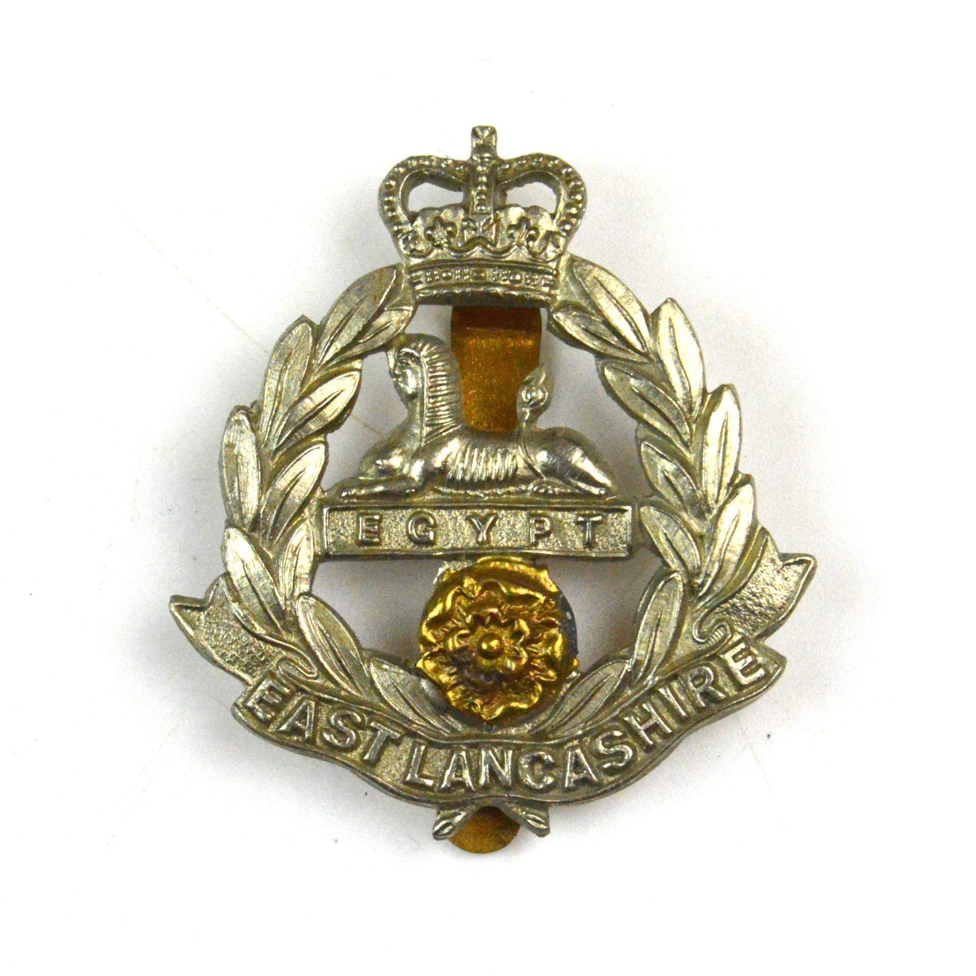 East Lancashire Regiment Bimetal Cap Badge, Queen's Crown, Original - Jeremy Tenniswood Militaria